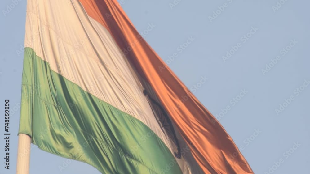 India flag flying high at Connaught Place with pride in blue sky, India ...