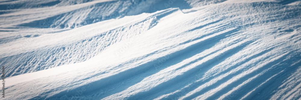 Snow texture. Wind sculpted patterns on snow surface. Wind in the ...