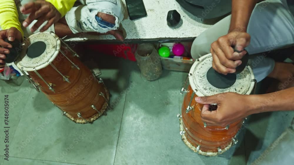 Two people playing traditional Indian tabla drums closeup of hands and ...