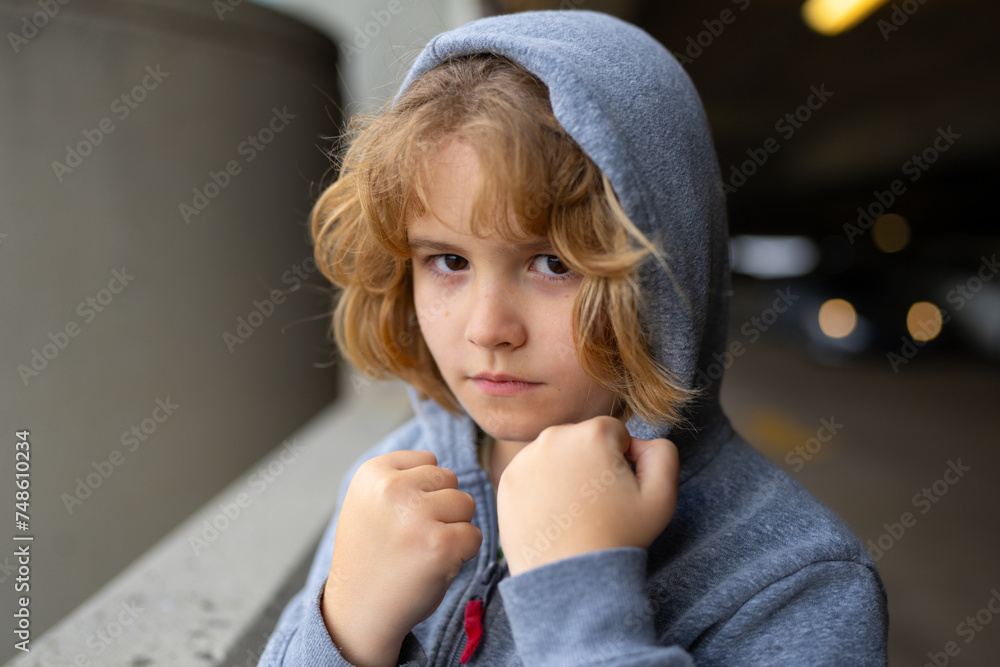 Aggressive child. Aggression kid boy fighting on street. Angry ...