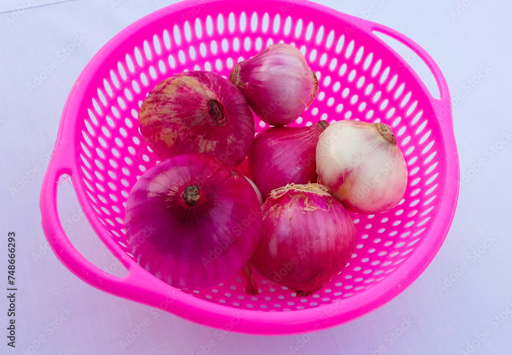 Onions in Pink Bucket on isolated with White Background.The onion ...