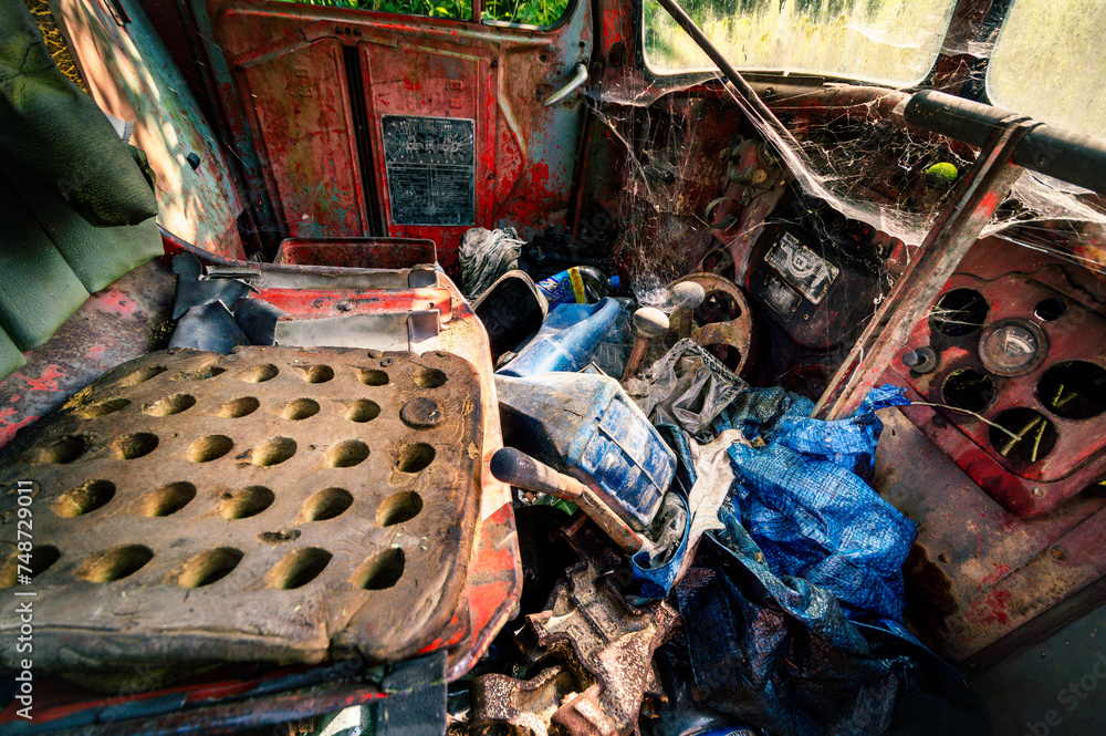 Interior of an abandoned old car. The neglected cabin of a heavy ...