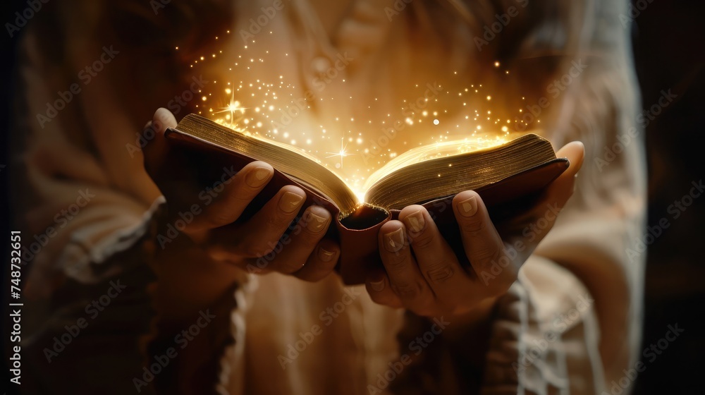 Light coming from book in woman's hands in gesture of giving, offering ...