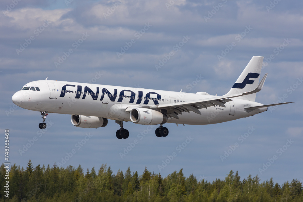 Helsinki, Finland - June 5, 2023: Finnish airline Finnair landing in Helsinki Vantaa with an ...