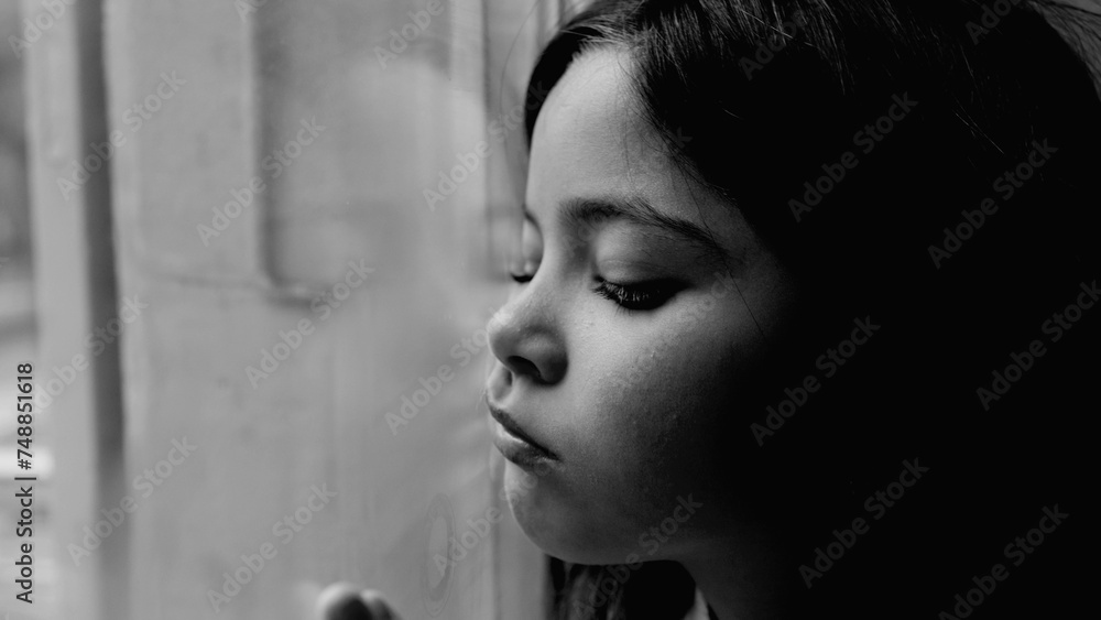 One unhappy somber little girl feeling depressed during hard times ...
