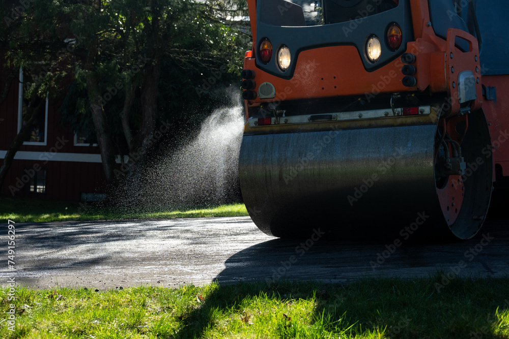 Residential street repaving project, closeup of a steamroller ...