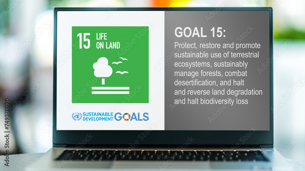 Laptop displaying logo of The Sustainable Development Goal 15 Stock ...