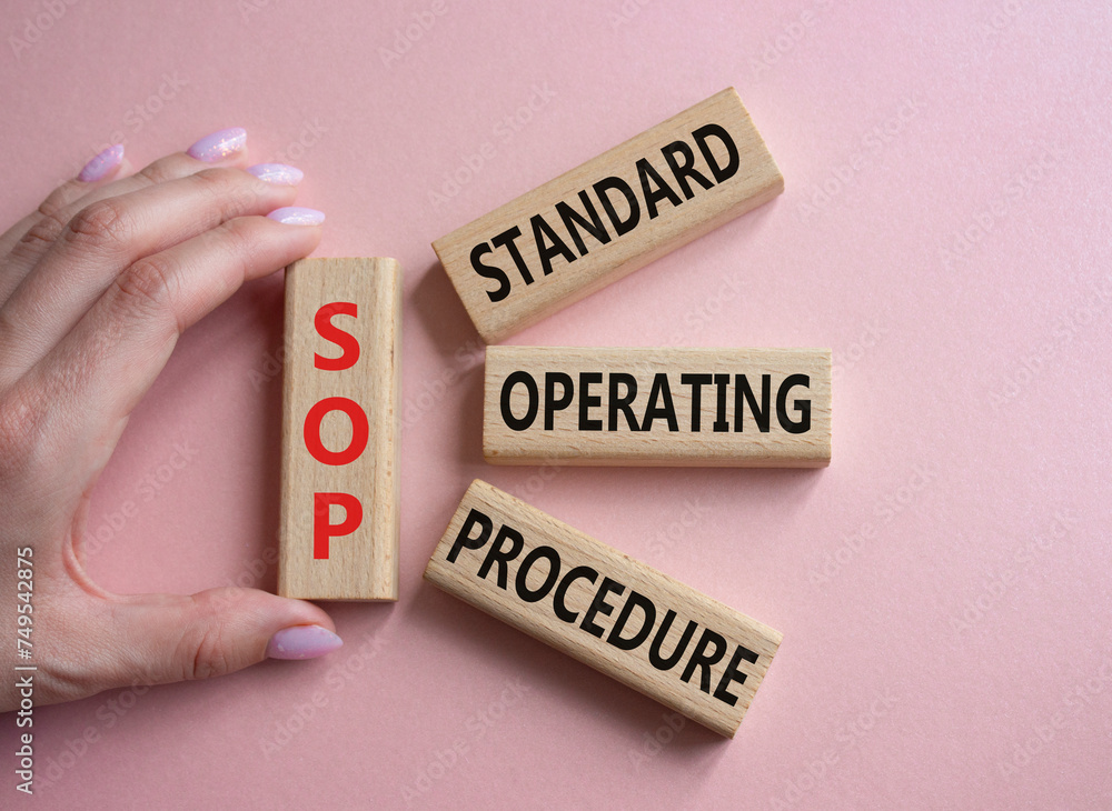 SOP - Standard Operating Procedure symbol. Wooden blocks with word SOP ...
