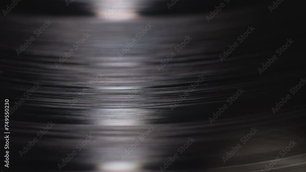 Vinyl record background black spinning. Vinyl disc spinning on a record ...