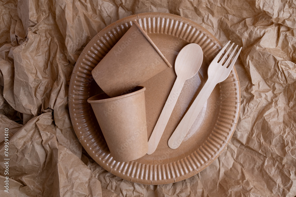 Kraft paper tableware: cups, food boxes, isolated on a light background ...