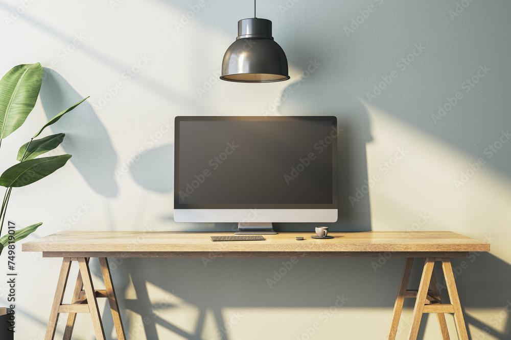 Modern home office interior with empty computer monitor on designer ...