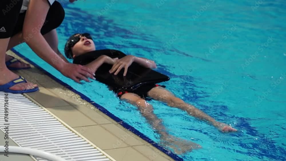 swimming pool training lesson for kids. little boy child learning to ...