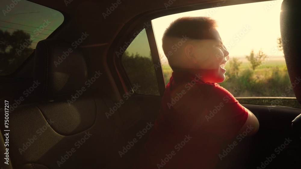 child kid looks out car window, looking out window waving hand, child ...
