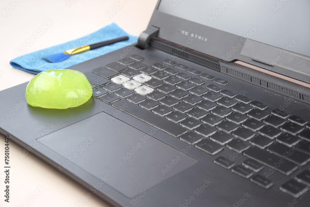 Green soft cleaning gel for cleaning dust on a laptop keyboard Asus Rog ...