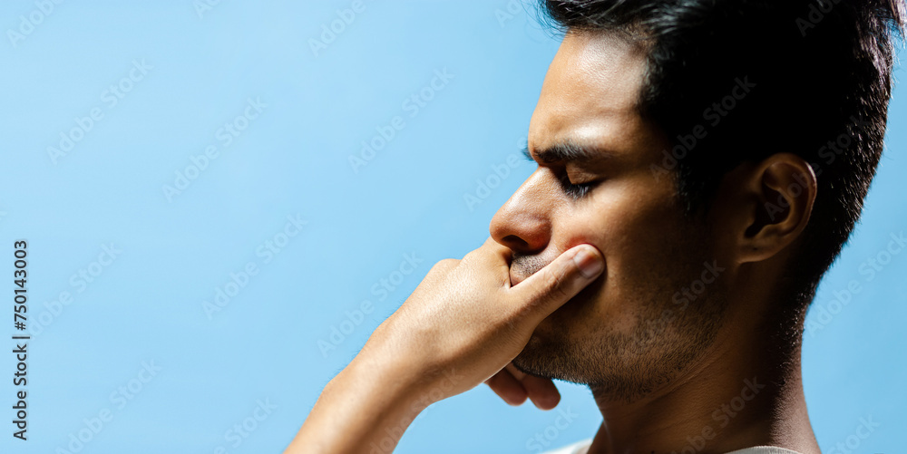 A young person with an expression of pain, sadness, apathy, and stress ...
