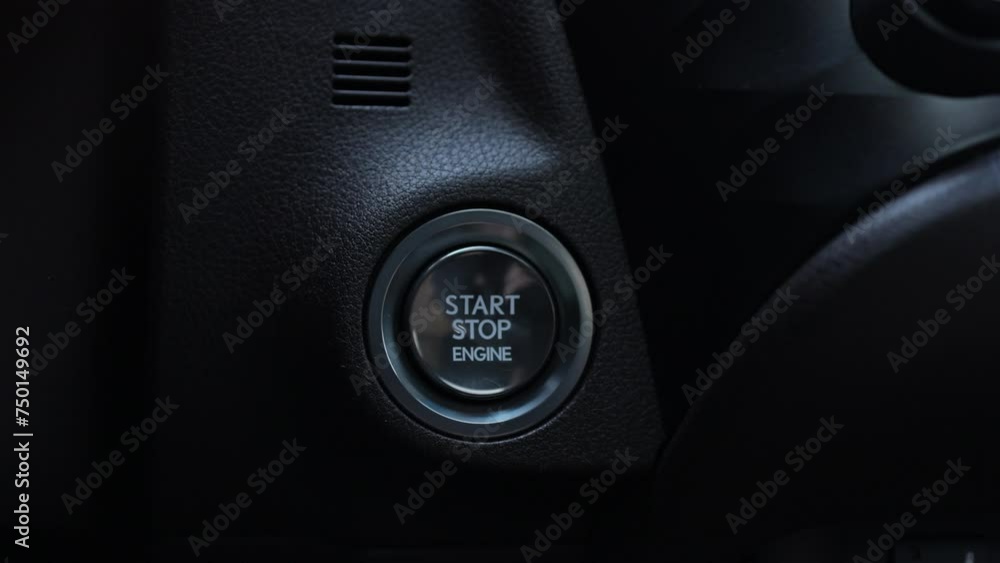 Starting car engine. Finger press the button to start the car engine ...