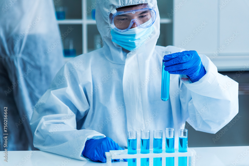 Scientist man holding sample blood test tube in science laboratory ...