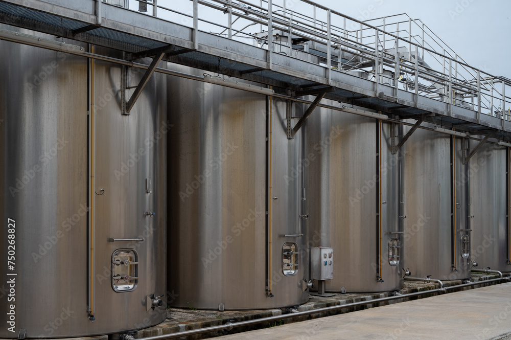 Works at distillery. Harvest time in Cognac white wine region, Charente ...