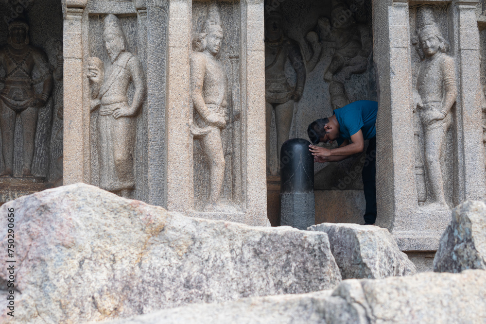 A hindu person praying to Shivling at world famous UNESCO world ...