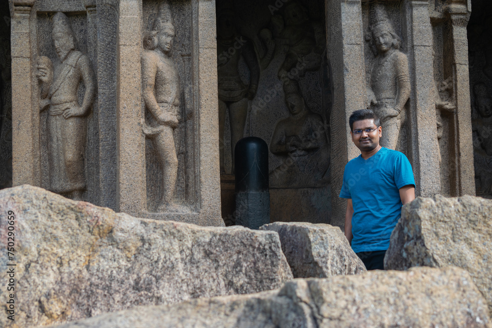 Person standing in front of temple of Lord Shiva world famous UNESCO ...