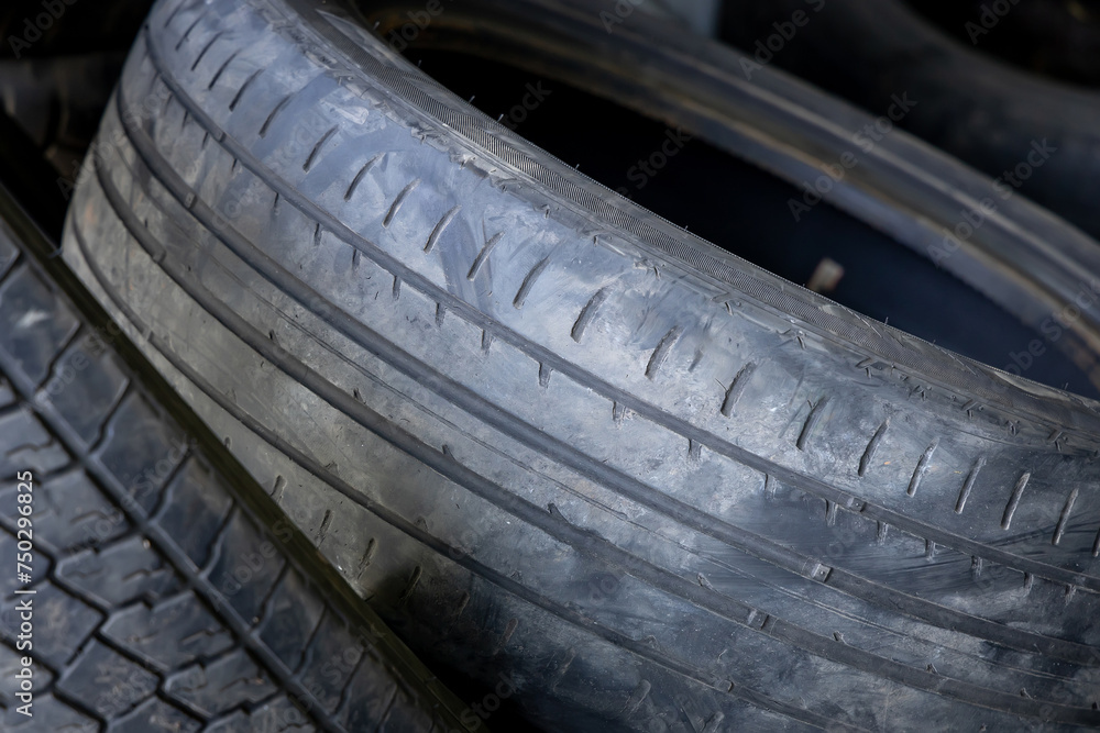 Wear and tear of old rubber car tires. Worn out treads of old rubber ...