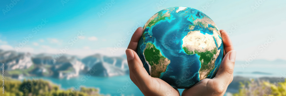 hands holding a detailed globe against a blurred landscape, could be ...
