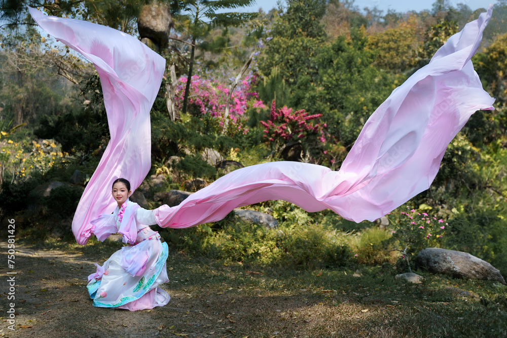 Pretty Asian girl in a beautiful elegant ancient Chinese costume ...