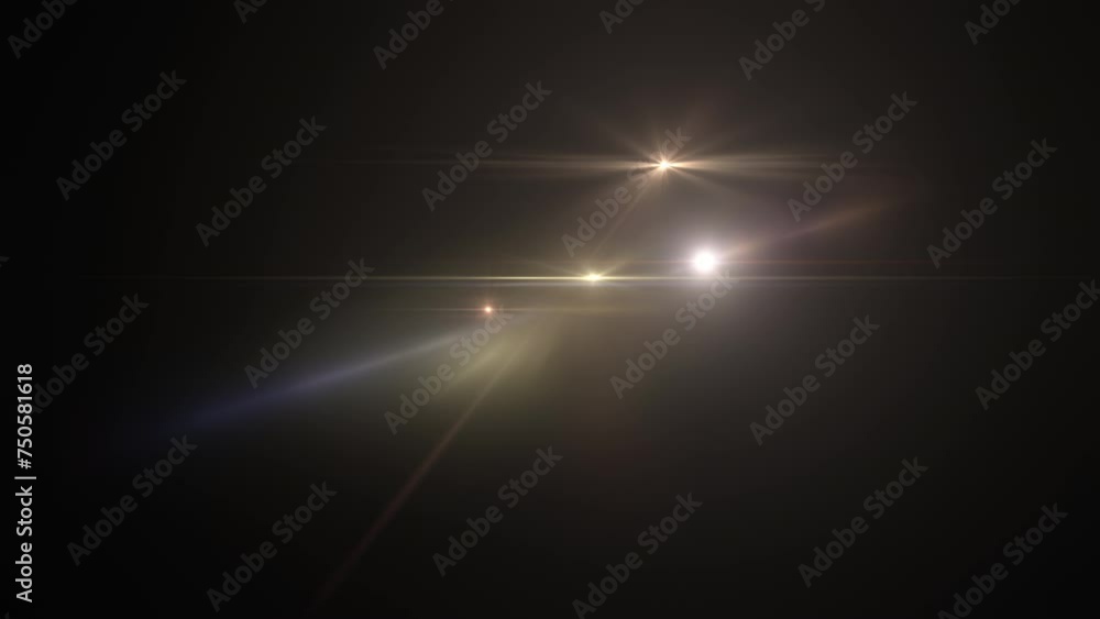 Abstract gold optical shine light lens flares moving from bottom left ...