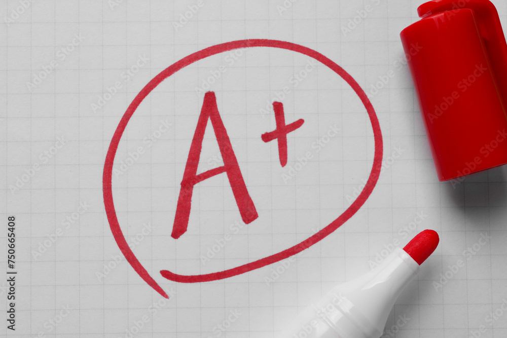 School grade. Red letter A with plus symbol on notebook paper and ...