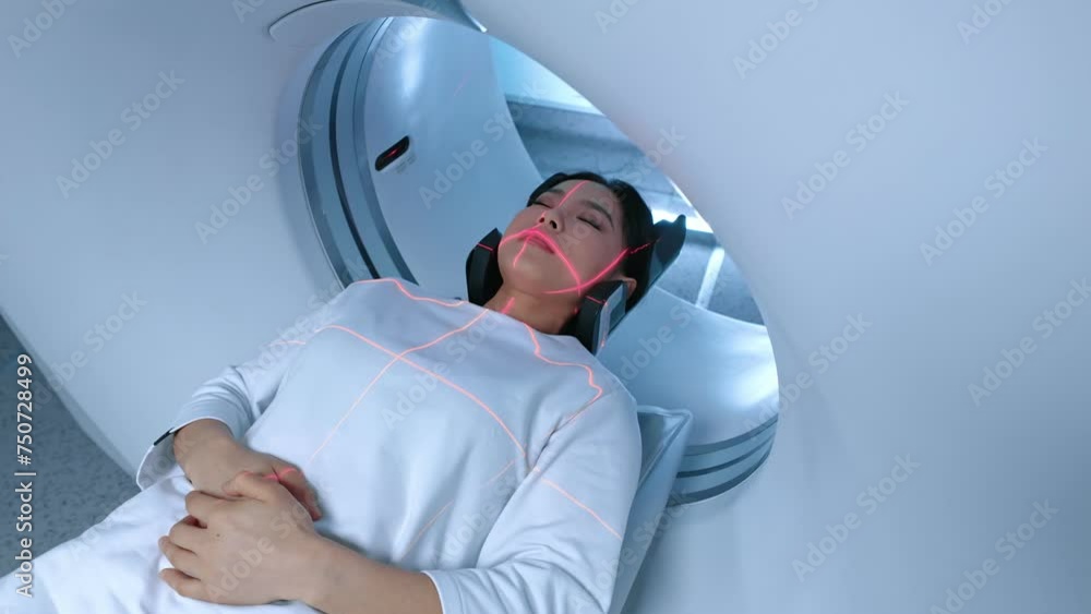 Patient dressed up in white clothes undergoes magnetic resonance ...
