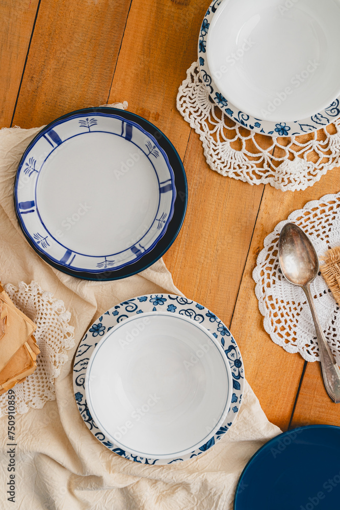flatlay vintage grandma table setting with 3 plates bowl empty over ...