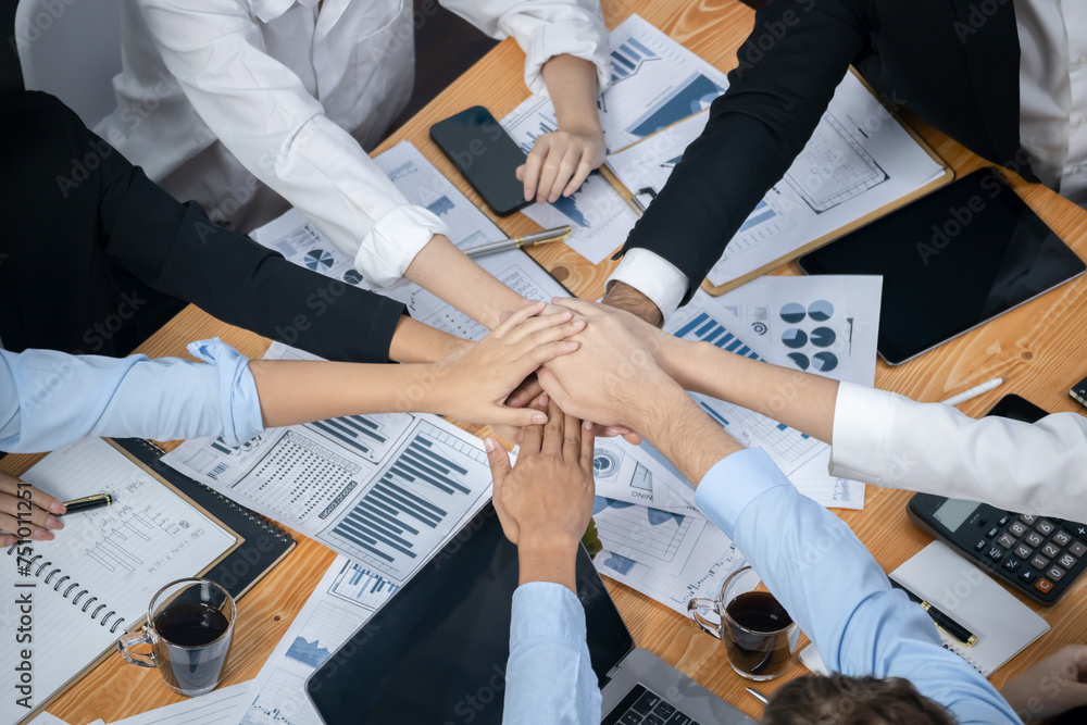 Multiracial business people make synergy hand stack together in meeting ...