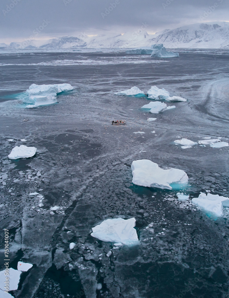 Indigenous Inuit boat fishing in Arctic sea ice Stock Photo | Adobe Stock