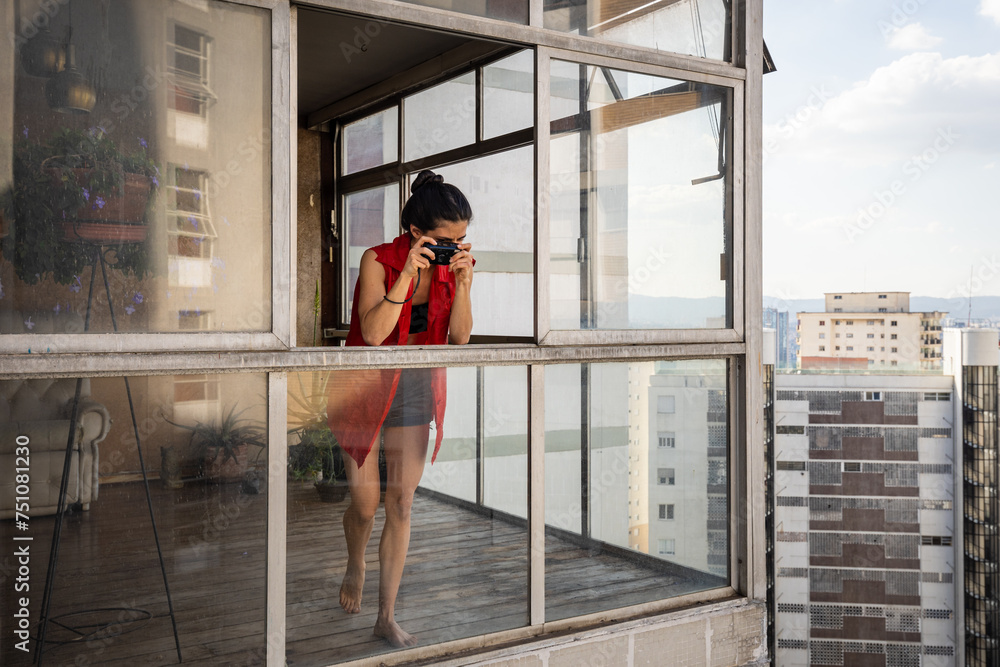 Stalker woman taking pictures of neighbours from her building Stock ...