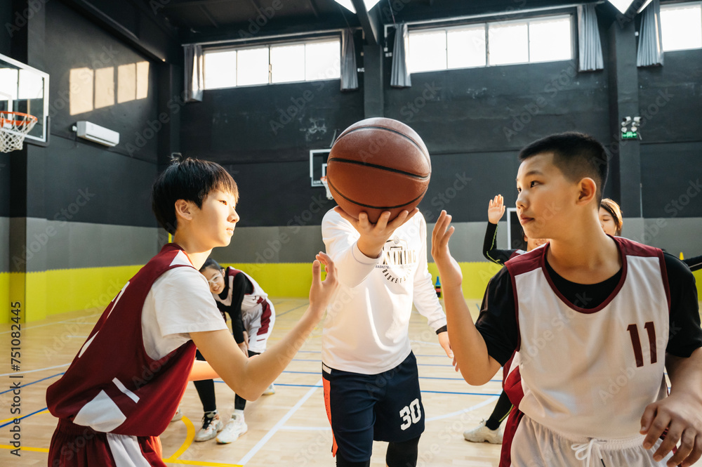 Basketball team competing in game Stock Photo | Adobe Stock