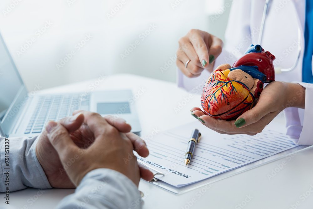 Heart disease. Female doctor gives advice on heart disease treatment. A ...