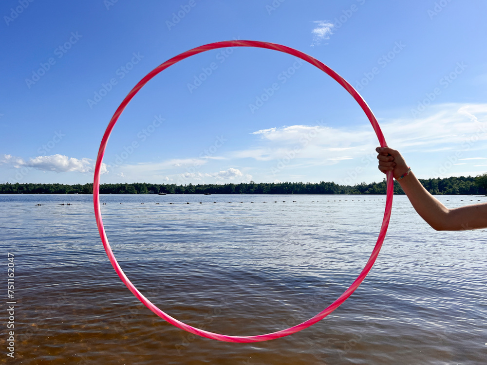 Hand holding Hula Hoop at lake landscape New Hampshire in summer Stock ...