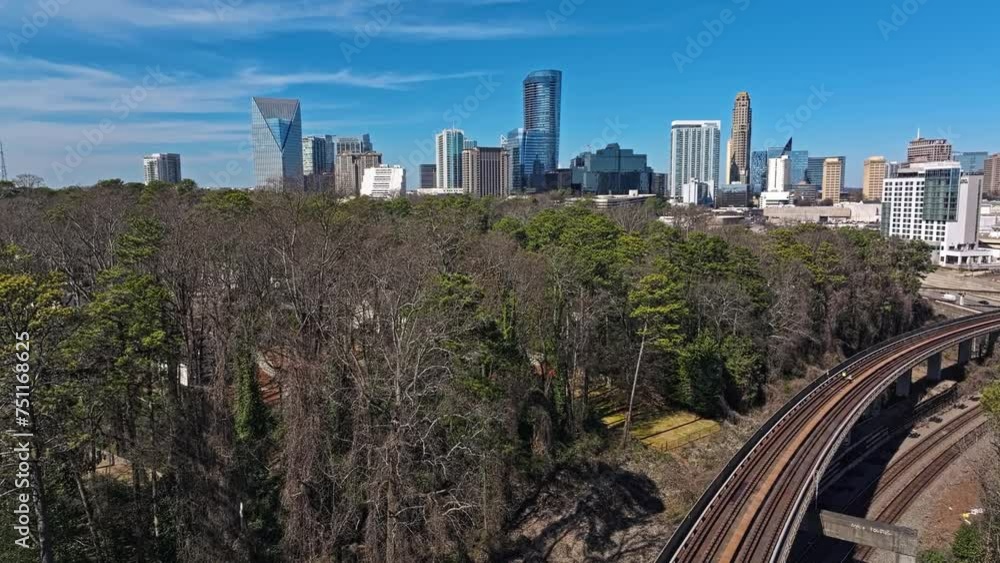 High Rails in suburb forest of Atlanta Town in sunlight. Skyline with ...