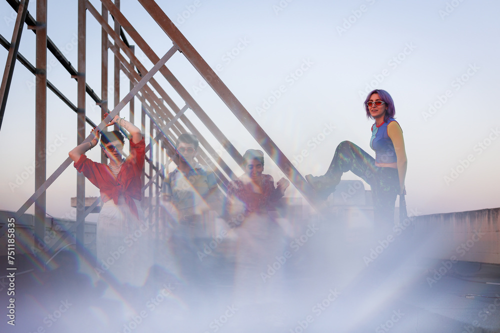 Light effect over group of young people wearing colorful clothes Stock ...