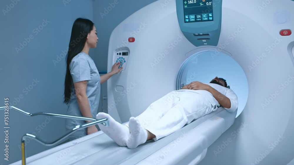 Neuroscientist doctor putting buttons on MRI device. Radiologist nurse ...