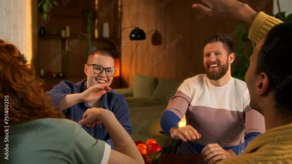 friends hanging out together at home sitting and chatting. give high ...