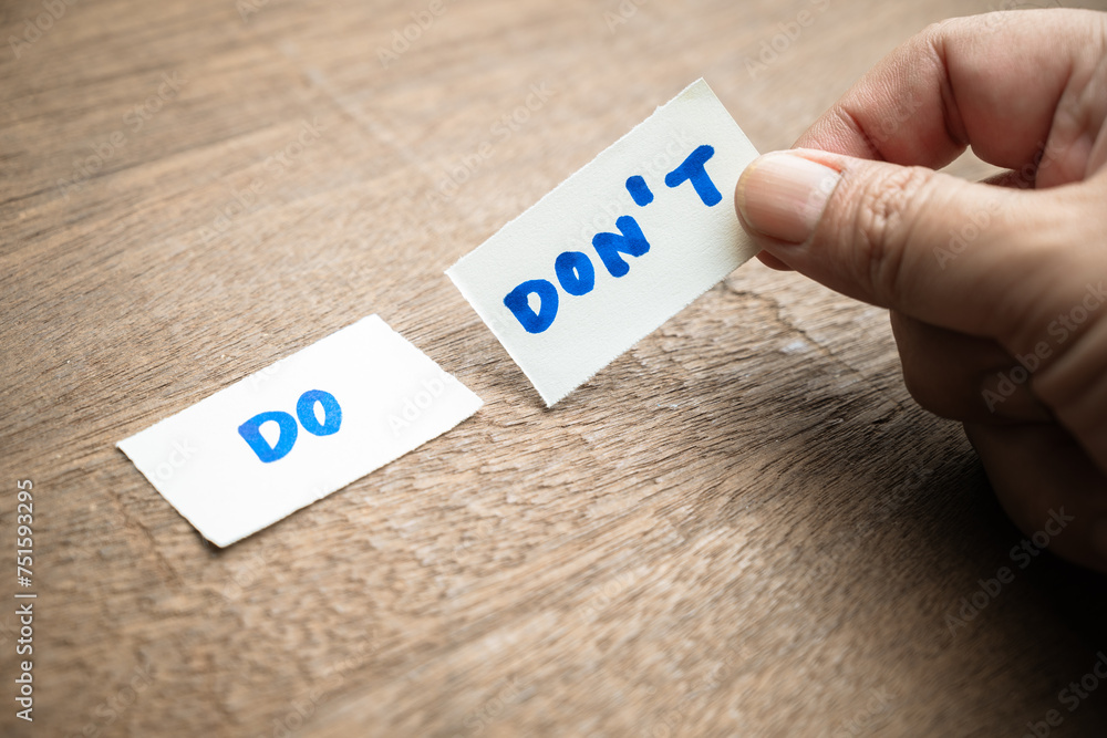 Do and Don't concept by two pieces of paper with handwriting text ...