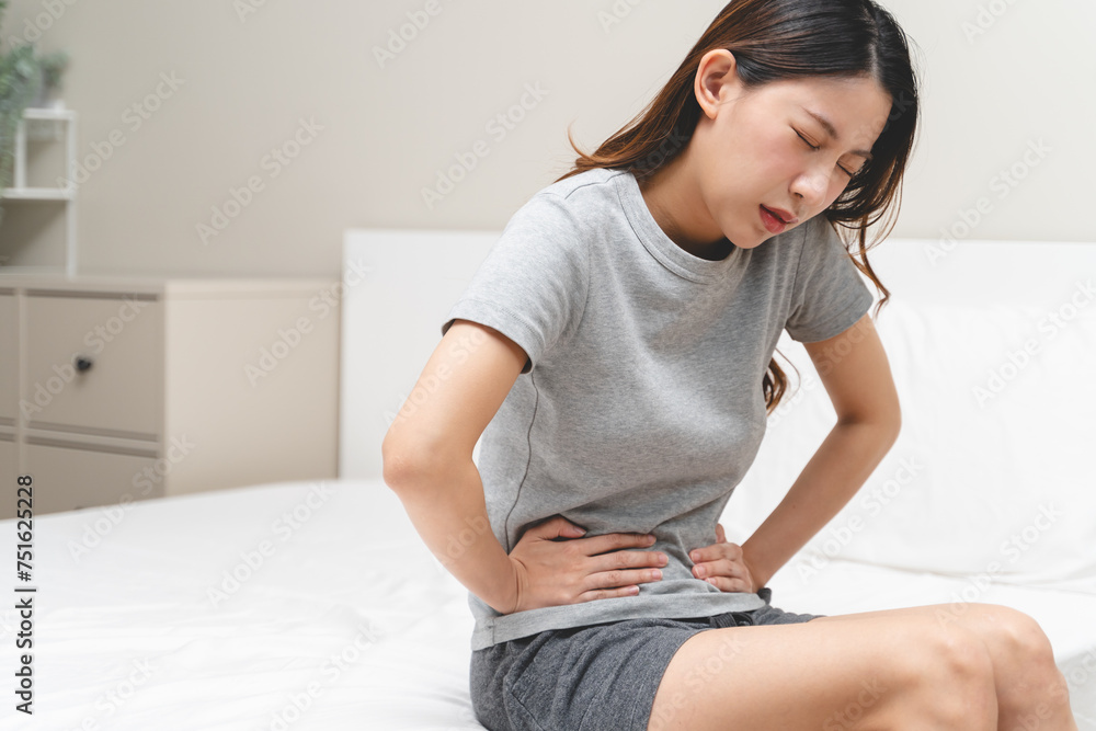 Menstruation symptom concept, Close-up woman touching her belly and ...