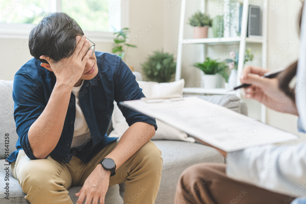 Psychology, depression. Sad, suffering asian young man, male consulting ...