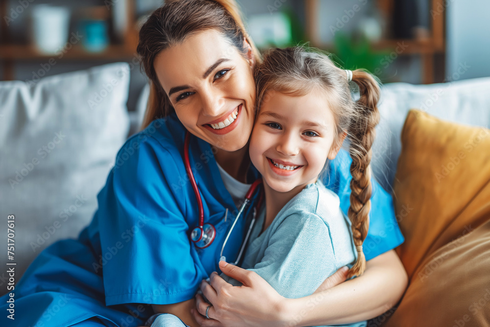 Happy child hugs doctor. Happy, smiling woman pediatrician in uniform ...