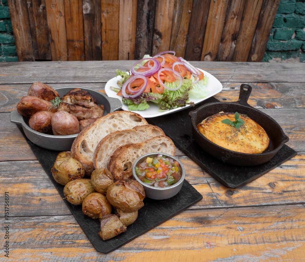 Argentinian traditional food. Top view of a barbecue with chorizos ...
