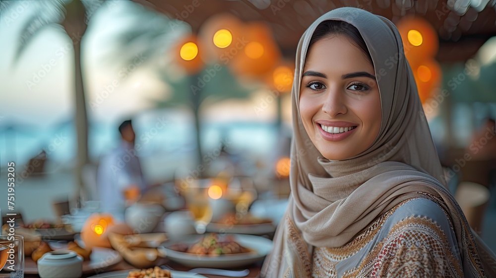 islamic family eating together at outdoor restaurant on arabian beach ...