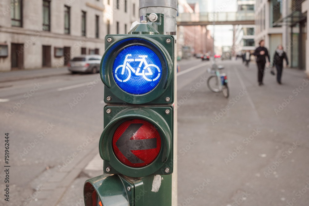 A close-up view of a traffic signal post at an urban intersection ...