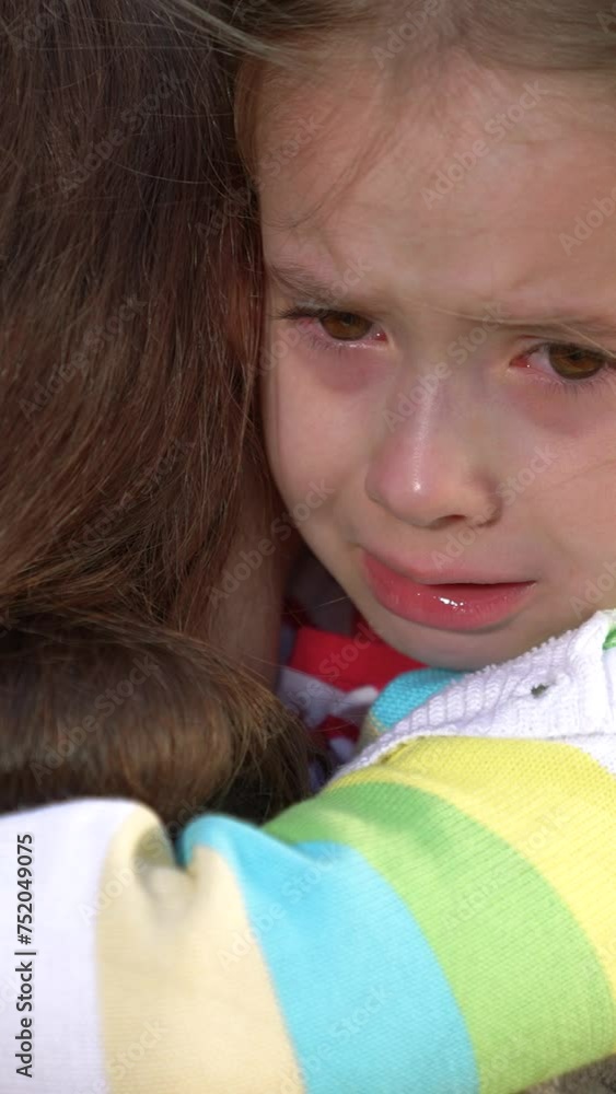 little child cries, tears child face, mother calms capricious kid girl ...