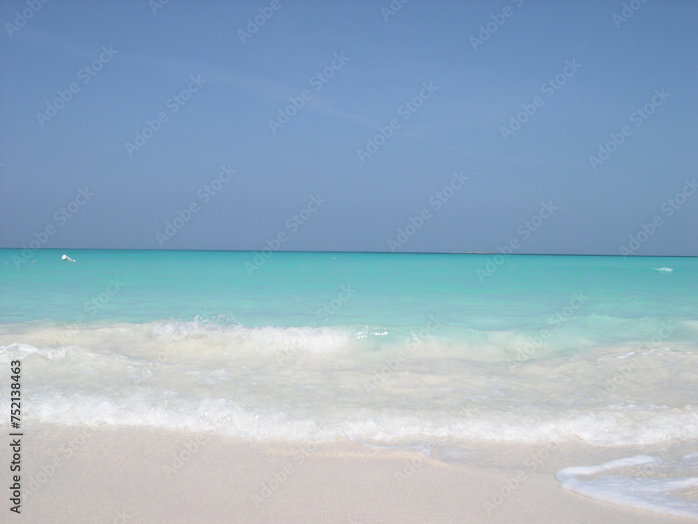 Turquoise sea water and blue sky on a beach in Little Exuma Island ...
